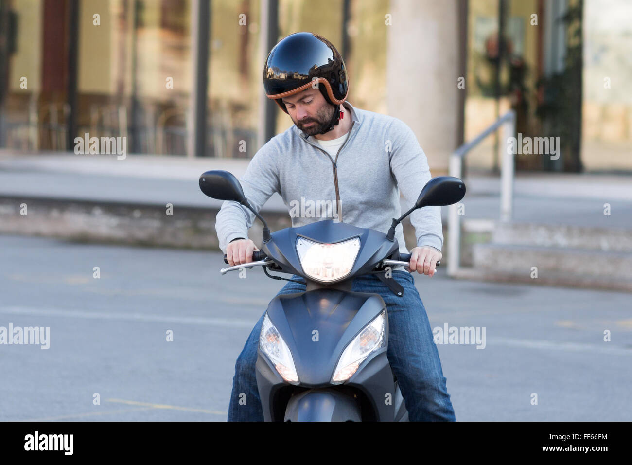 Man driving a scooter hi-res stock photography and images - Alamy