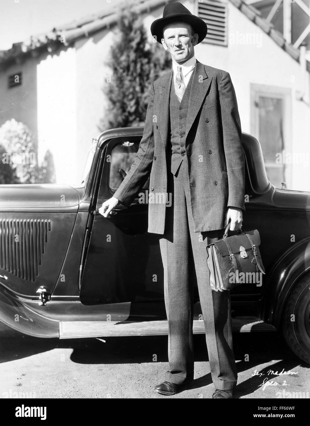 GIANT, 1934. /nTex Madsen, the world's tallest man, photographed in ...