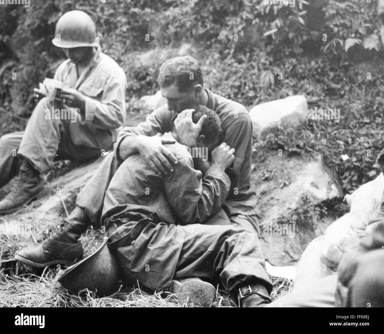 KOREAN WAR, 1950. /nAn American infantryman comforted by a comrade upon ...