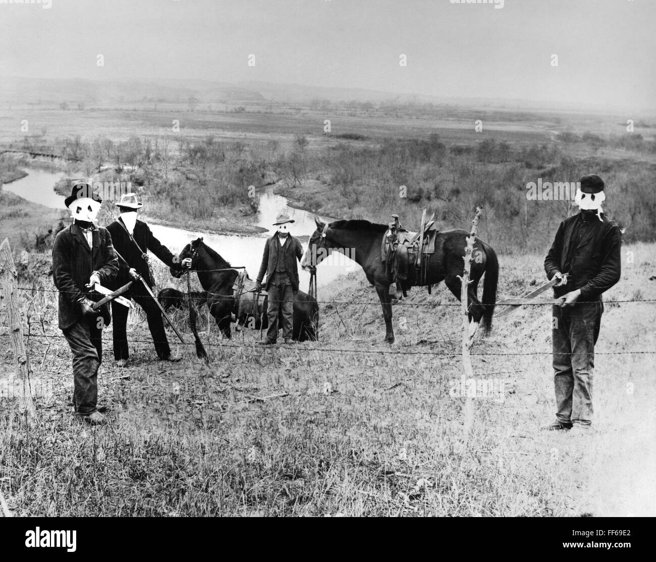 CATTLE RUSTLERS, 1885. /nFour men, their faces hidden with masks, cut ...