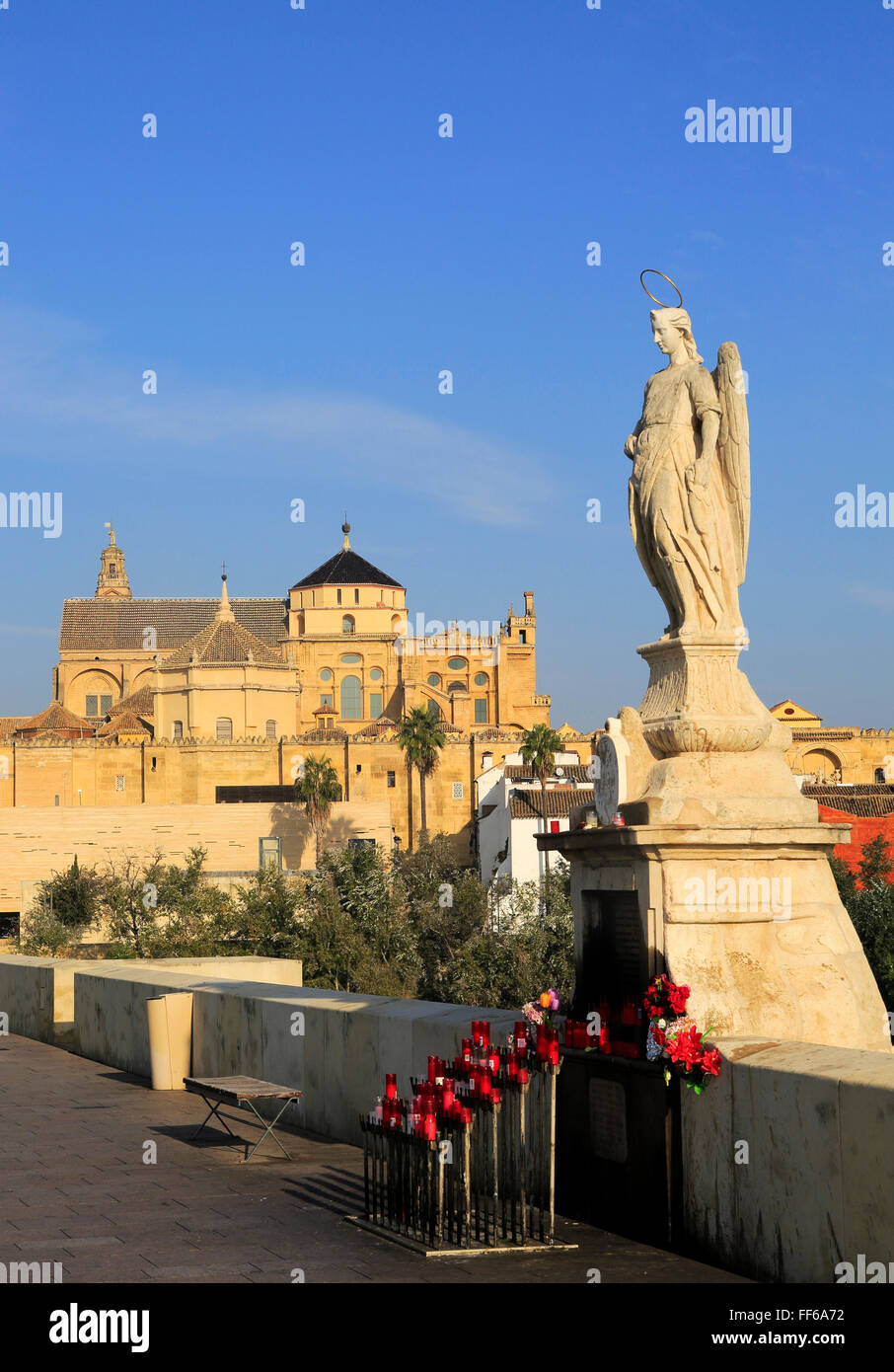 Angel San Rafael statue on Roman bridge with views cathedral, Cordoba ...