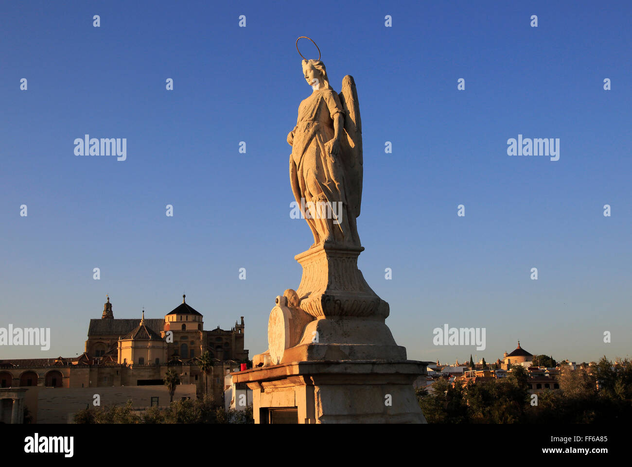 Angel San Rafael statue on Roman bridge Cordoba, Spain with view ...