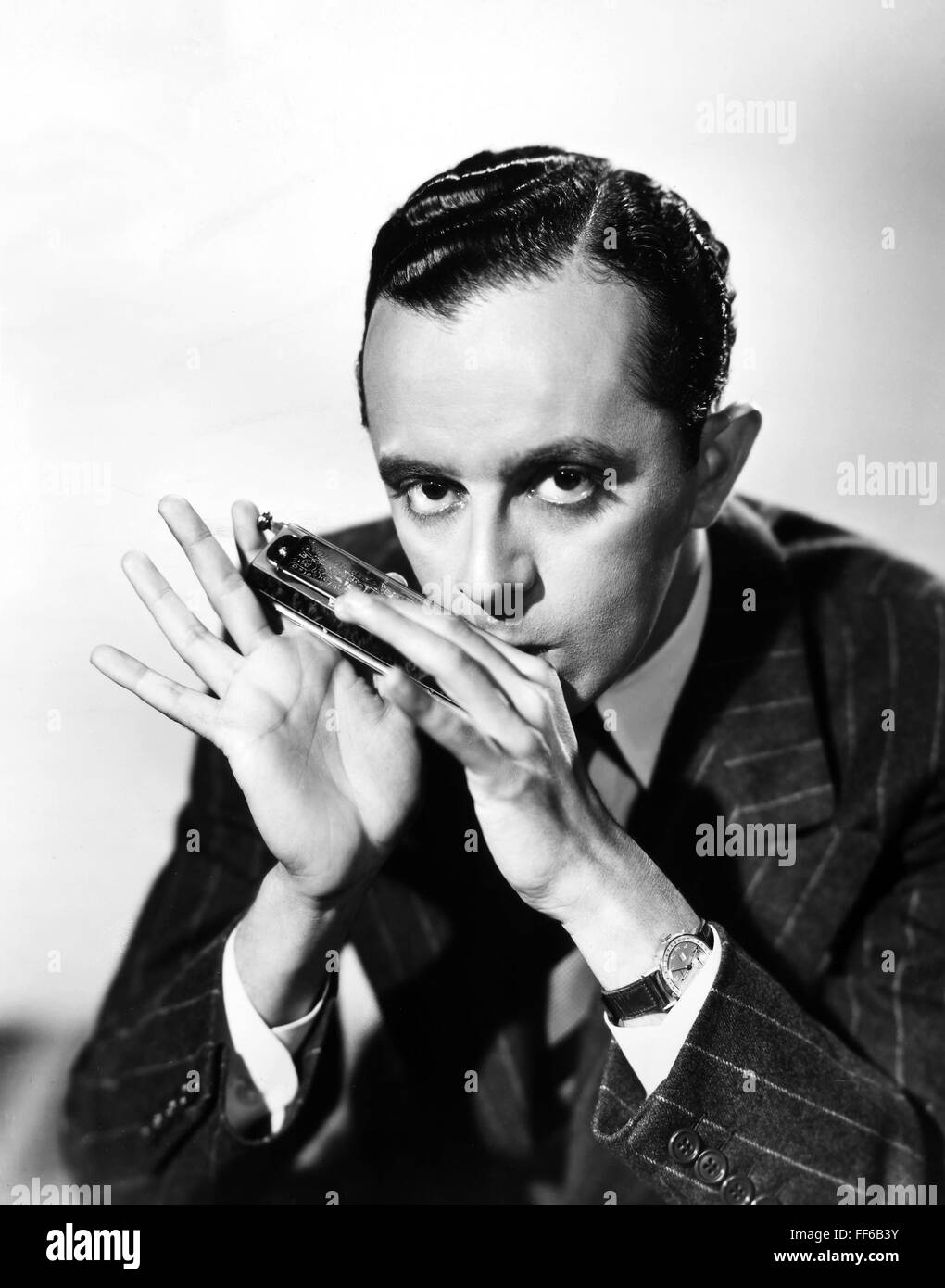 LARRY ADLER (1914-2001). /nAmerican musician Stock Photo - Alamy