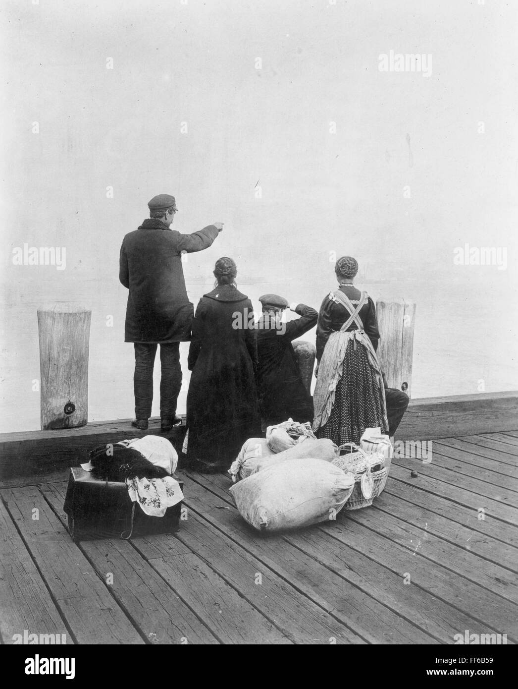 IMMIGRANT FAMILY, 1912. /nImmigrants on the dock at Ellis Island in New ...