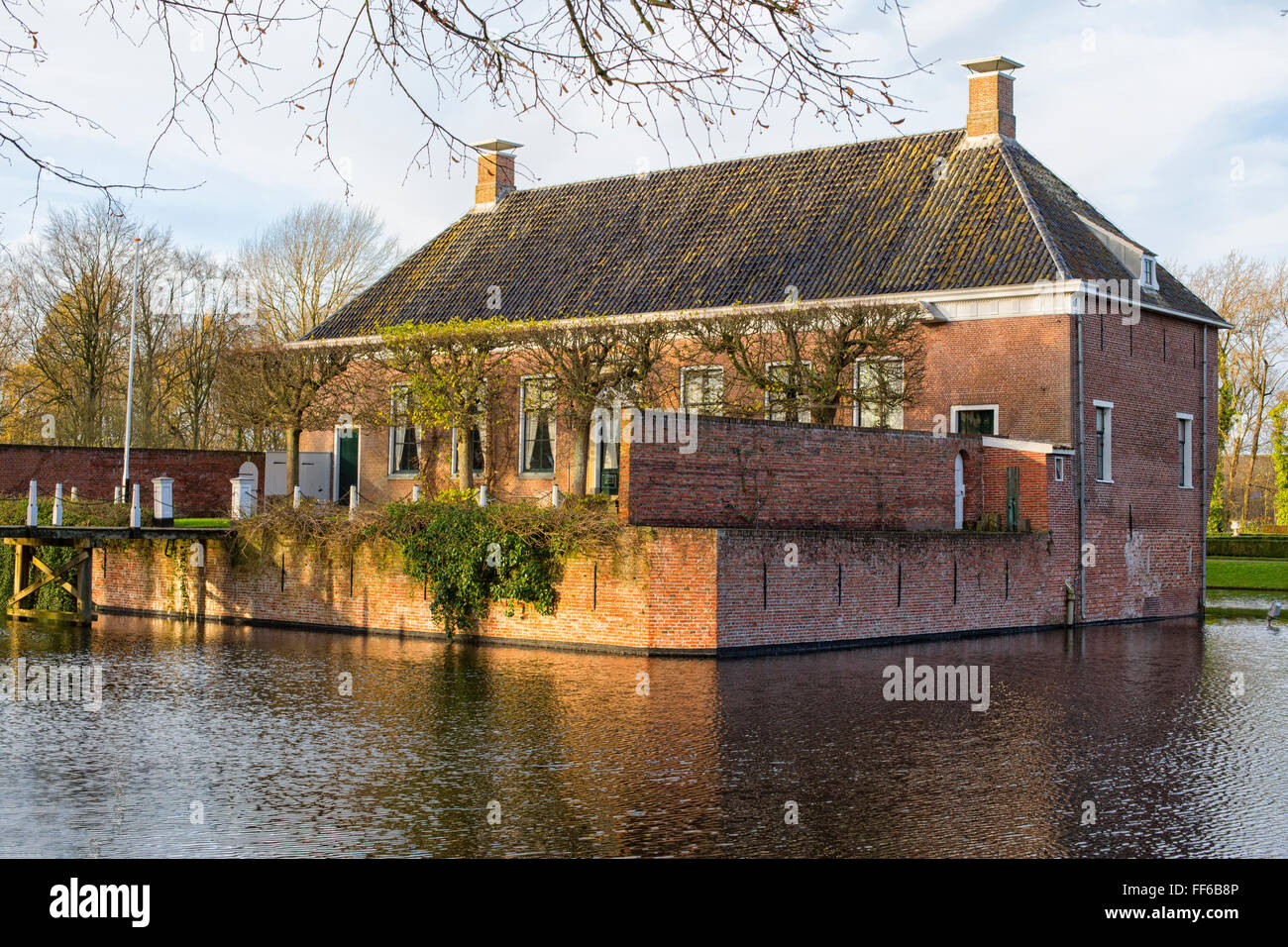 Beautiful old mansion with moat and bridge from 14th century in the ...