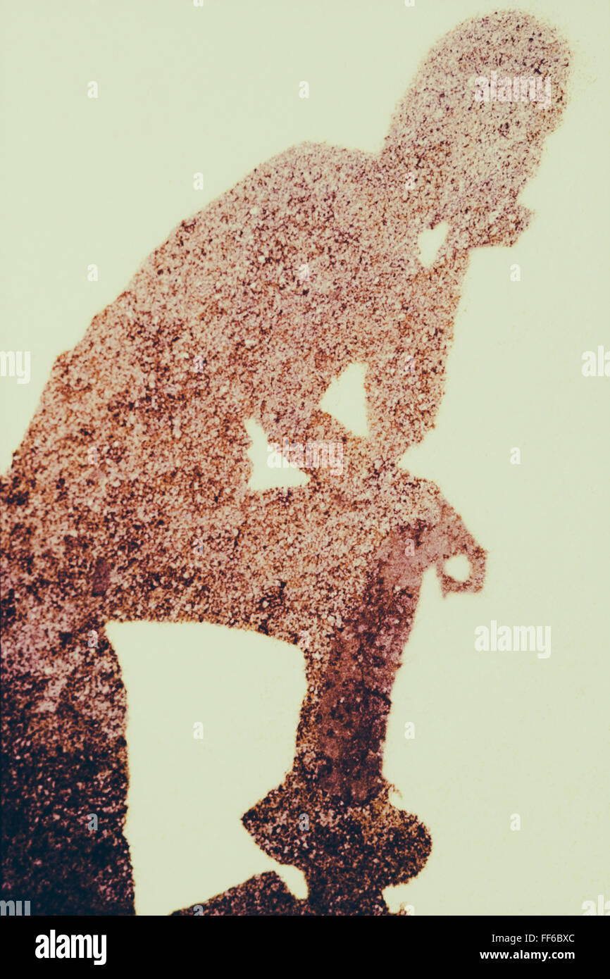 The outline of a human body, a shadow against a plain background in a ...