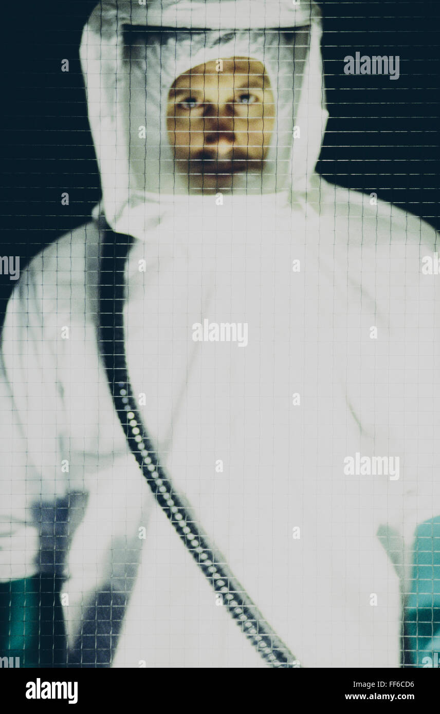 Portrait of man wearing protective clean suit Stock Photo - Alamy