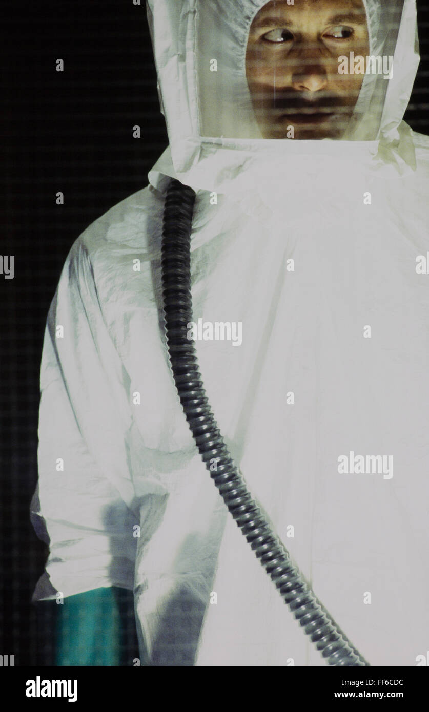 Portrait of man wearing protective clean suit Stock Photo - Alamy