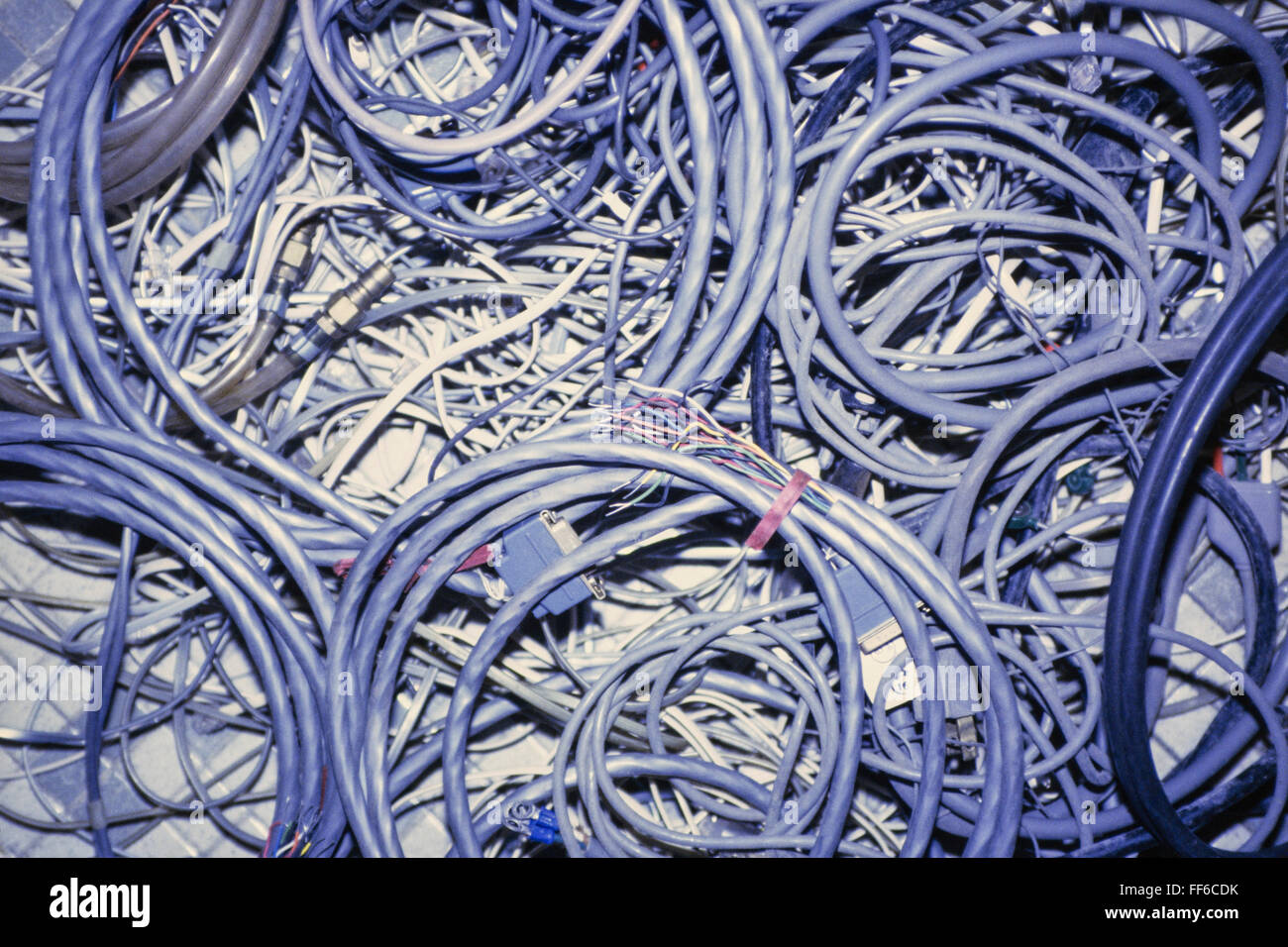 A mass of coiled and tangled computer and electrical cables Stock Photo ...