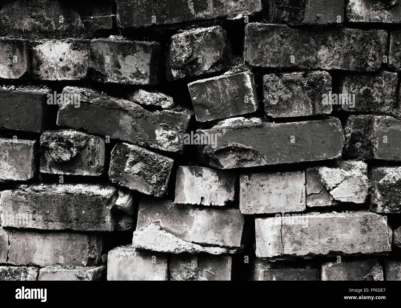 Pile of bricks with cracked and worn edges Stock Photo - Alamy