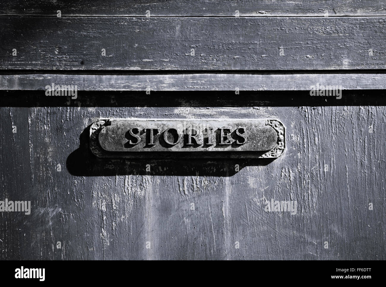 Stories plaque on a flat surface, a filing cabinet or drawer Stock ...