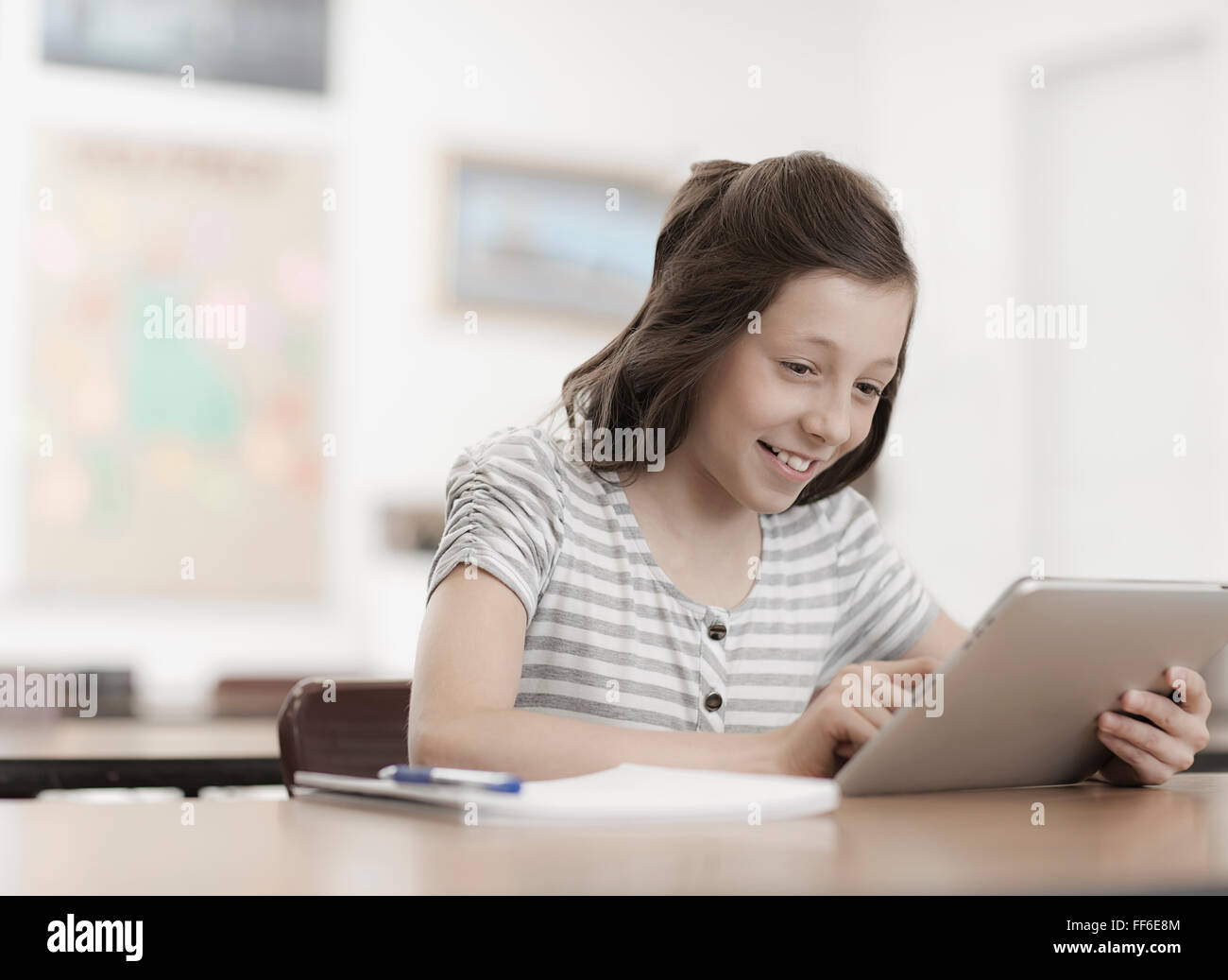 A young girl using a digital tablet Stock Photo - Alamy