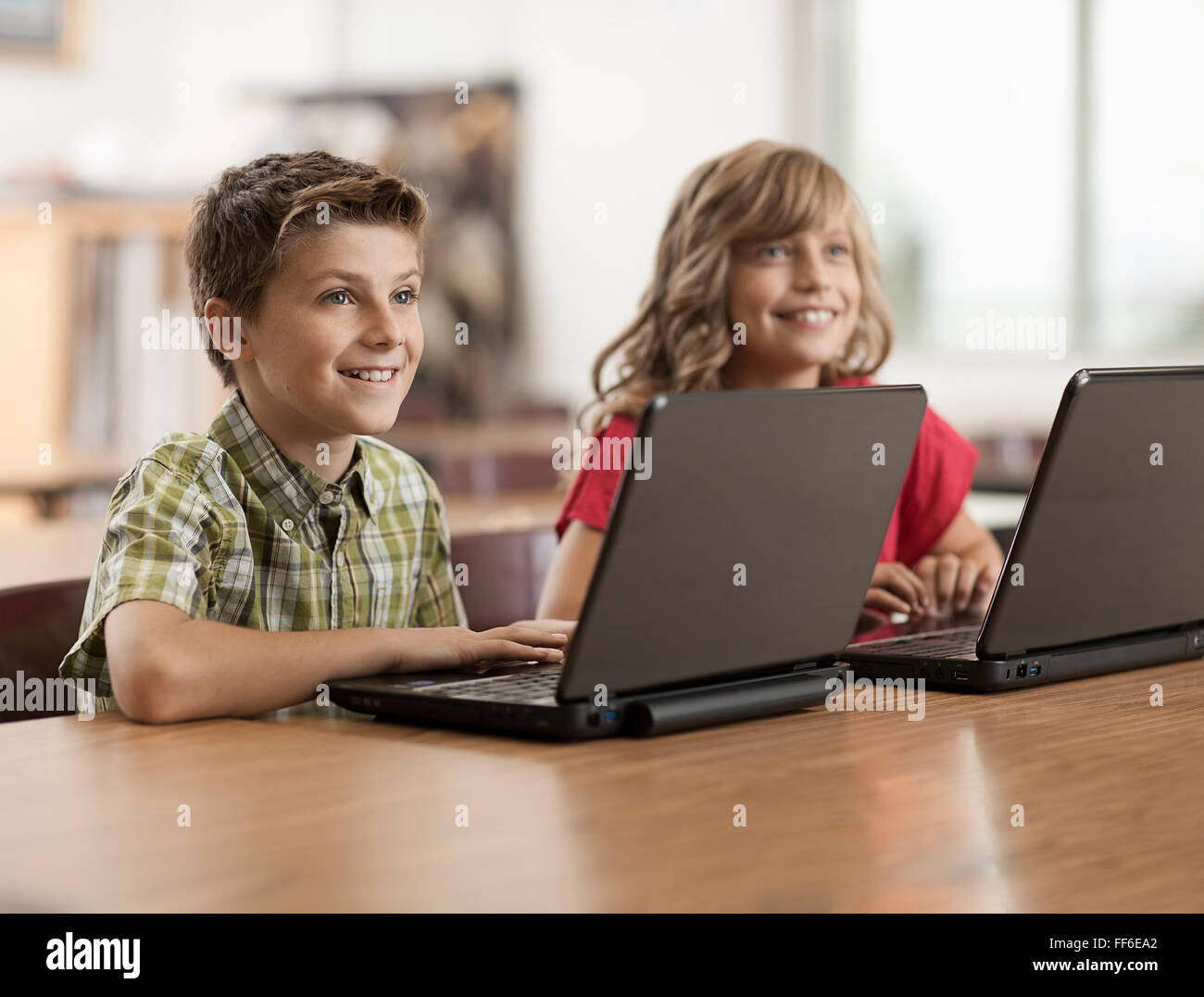 Two boys using laptop school hi-res stock photography and images - Alamy
