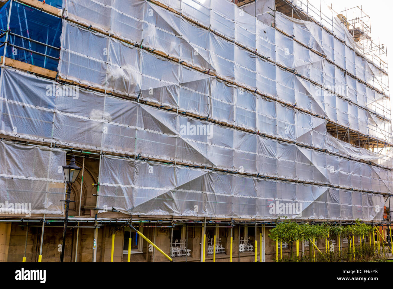 Scaffold with plastic sheet covering erected on a building Stock Photo ...
