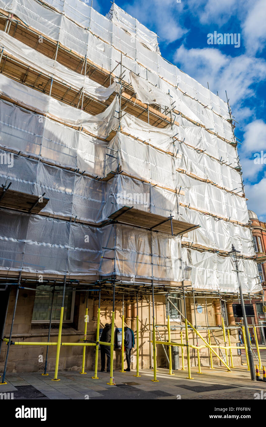 Scaffold with plastic sheet covering erected on a building Stock Photo ...