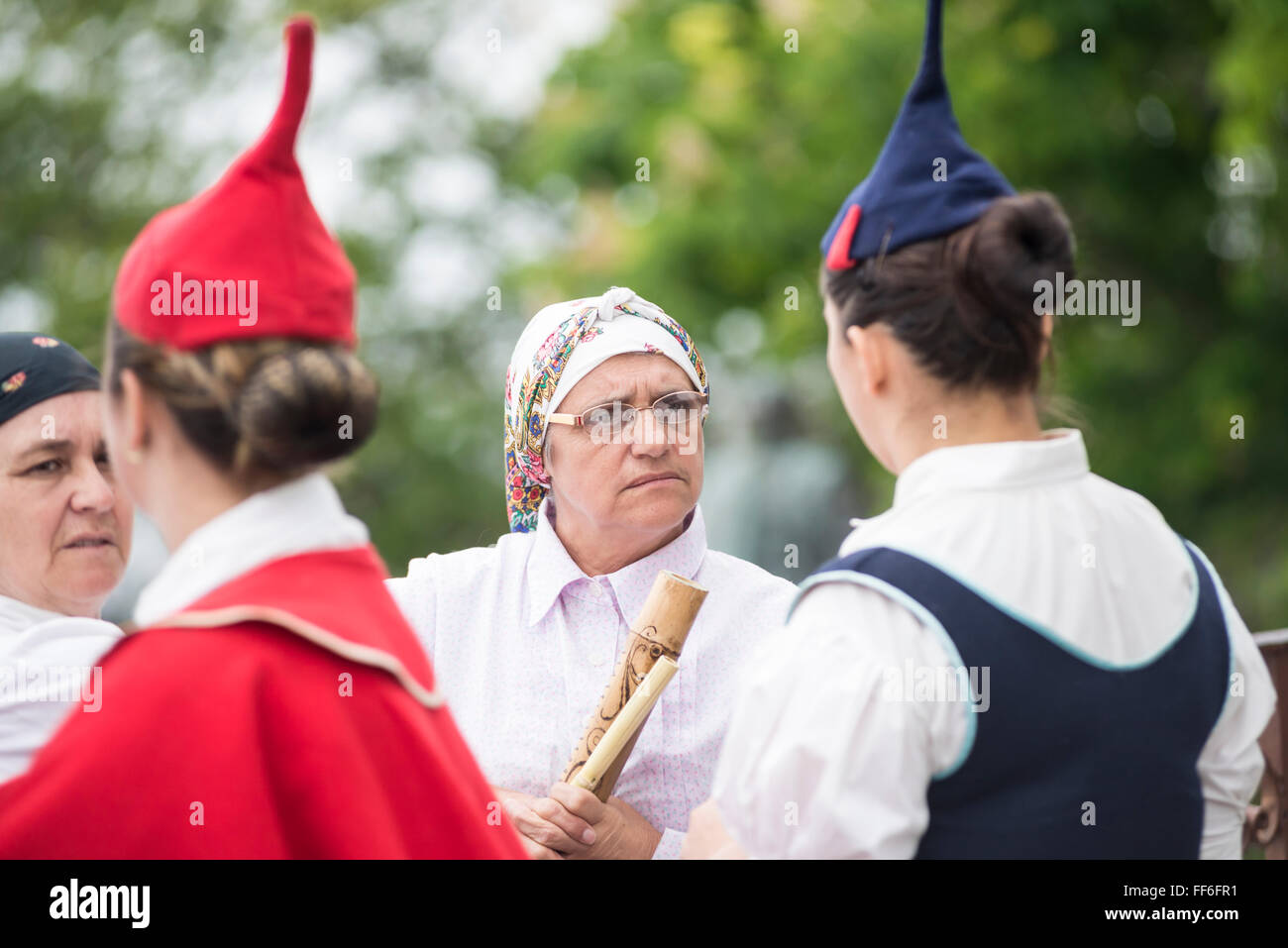 Women of a traditional music and folk dance group from Madeira waiting ...