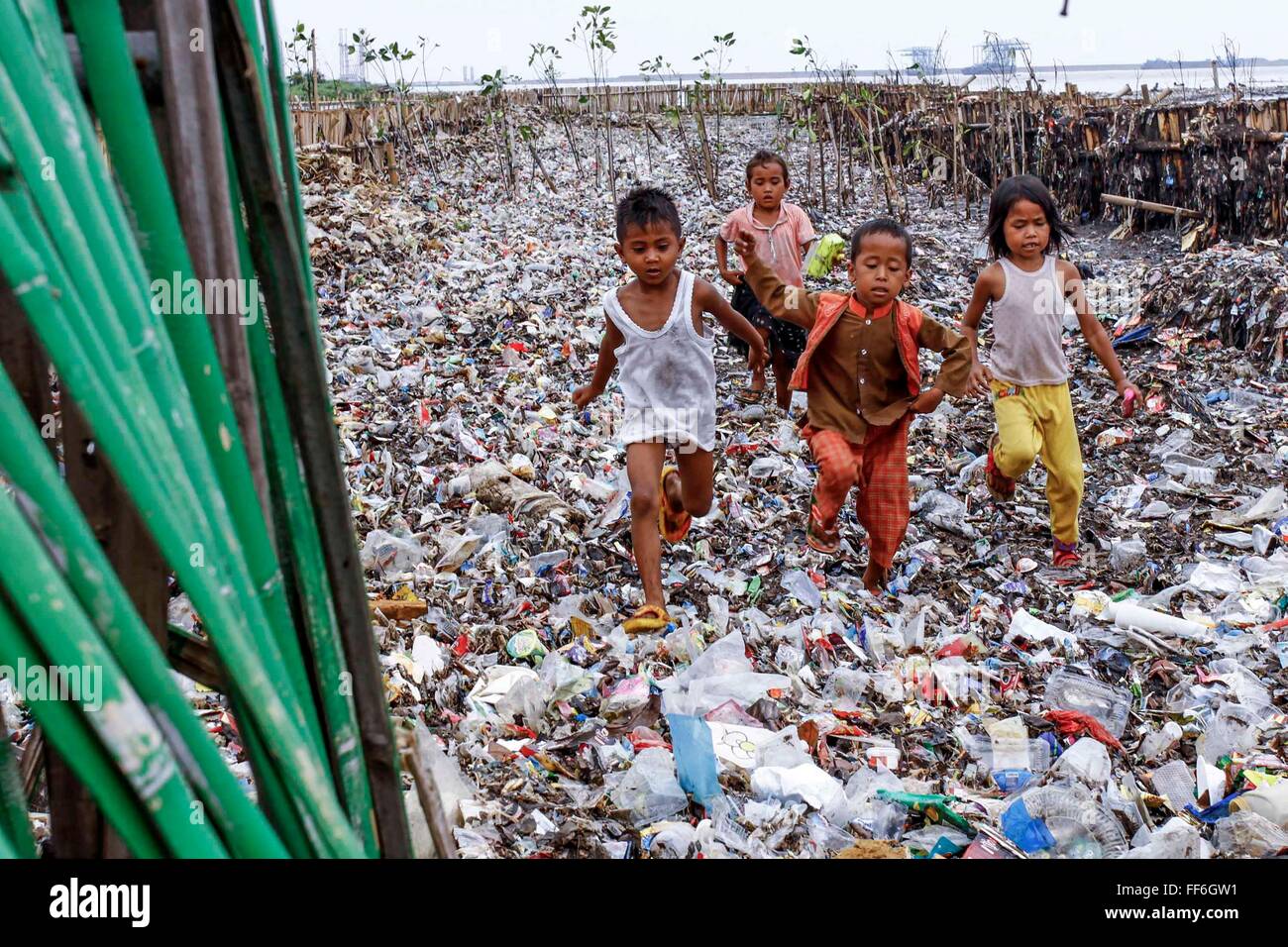 Children play on the garbage site at seafront Muara Angke. Now ...