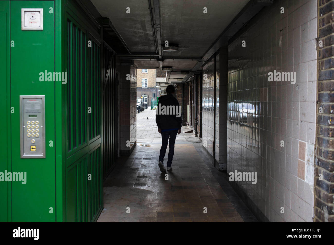 A vulnerable teenage youth hanging about on a Hackney estate, London ...