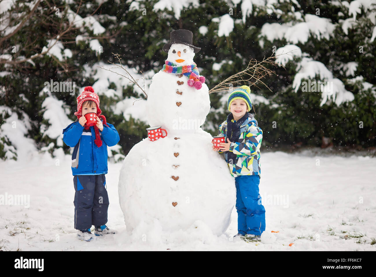 Group young people building snowman hi-res stock photography and images ...