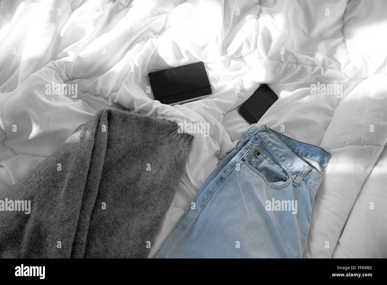 Clothes laid out on bed hi-res stock photography and images - Alamy
