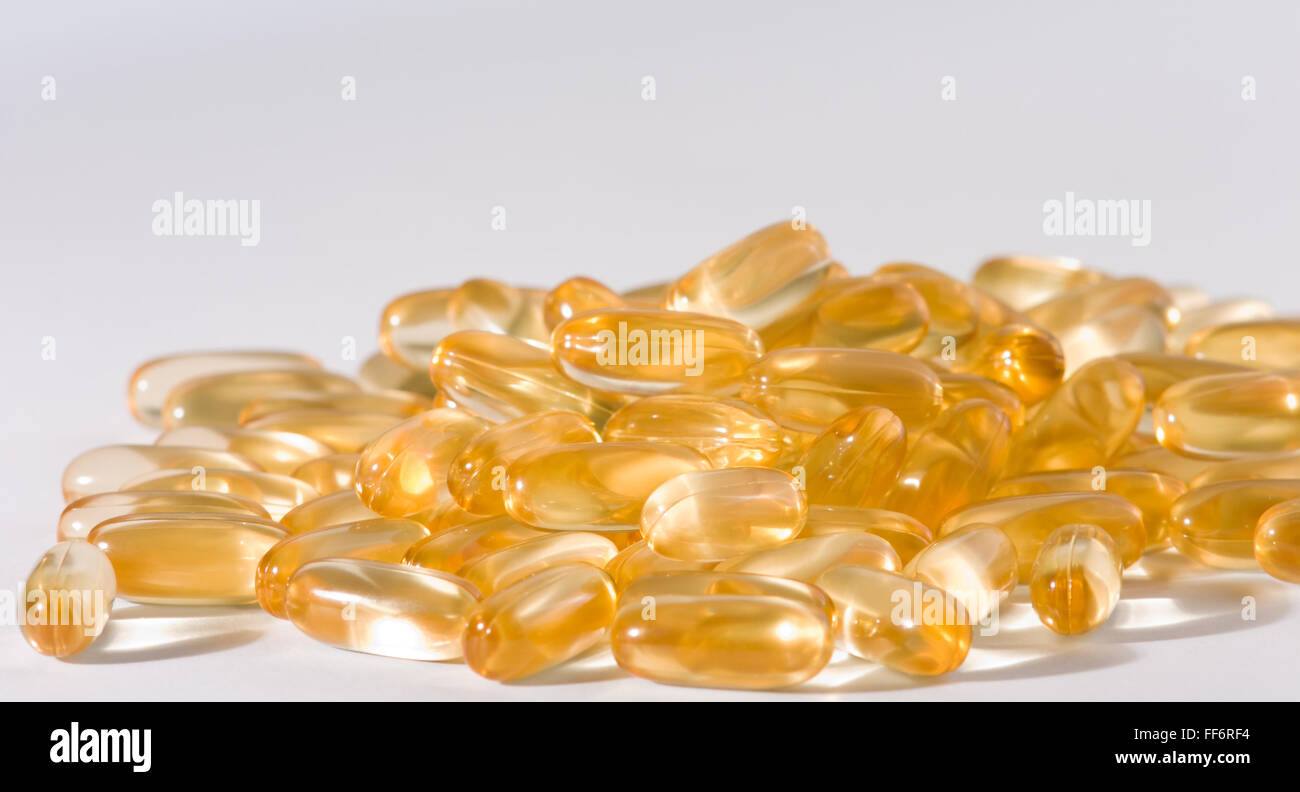 Cod fish liver oil yellow tablets Stock Photo - Alamy