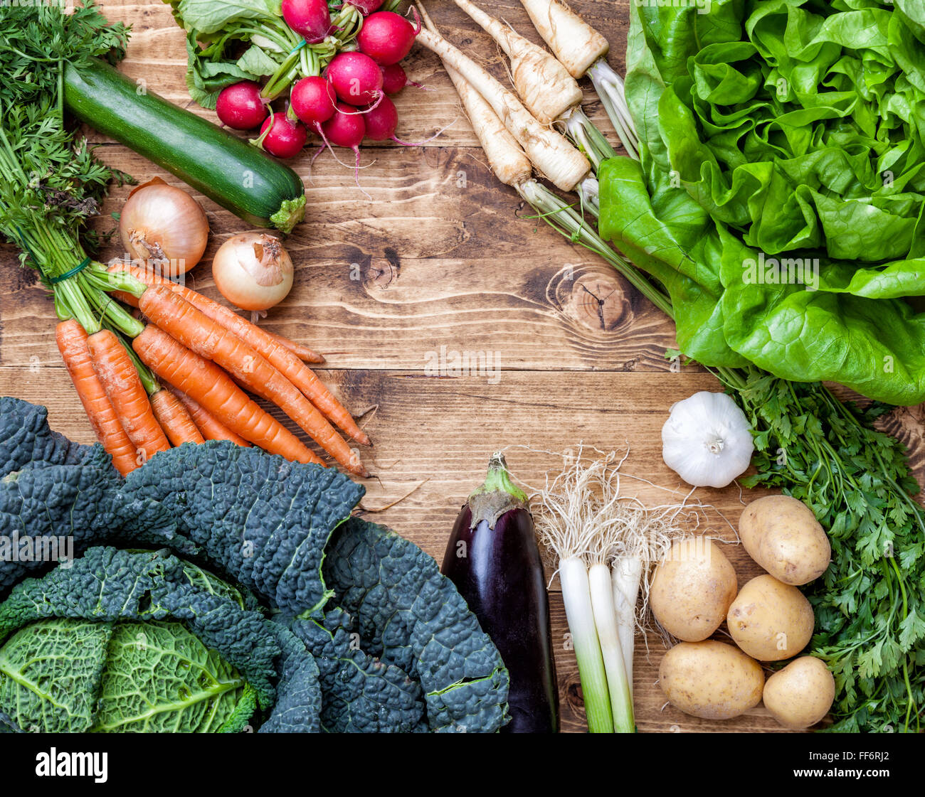 Fresh and organic bio vegetables on a wooden background Stock Photo - Alamy