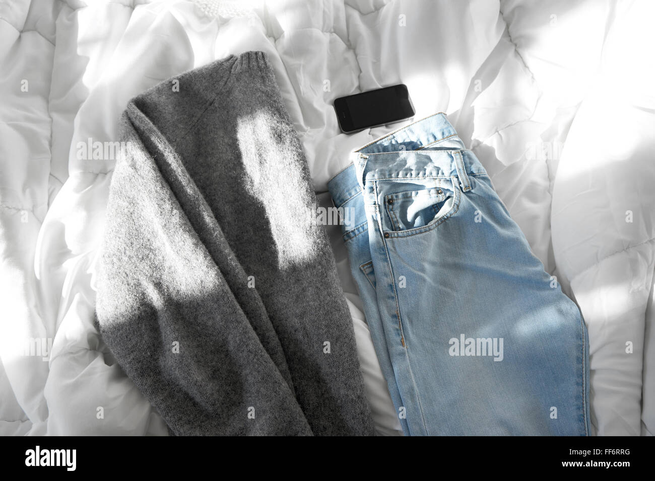 Clothes laid out on bed hi-res stock photography and images - Alamy