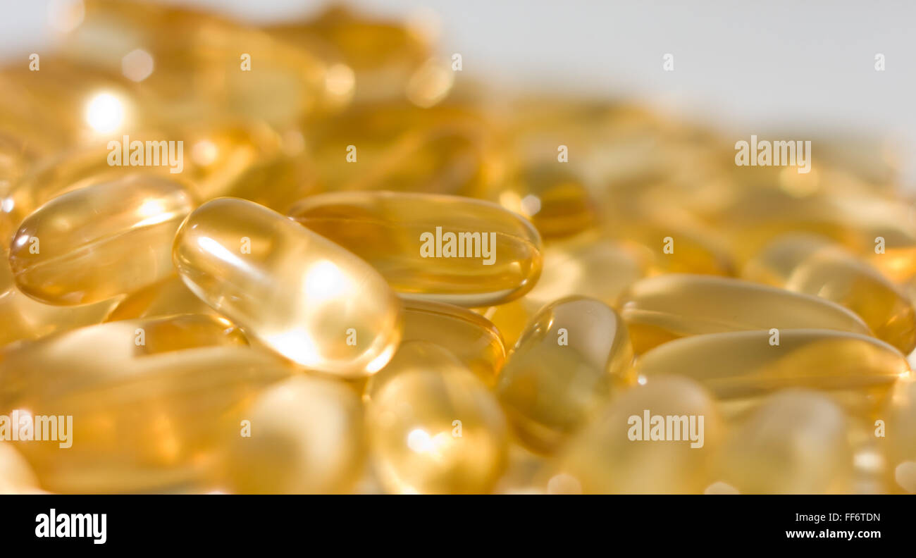 Cod fish oil capsule Stock Photo - Alamy