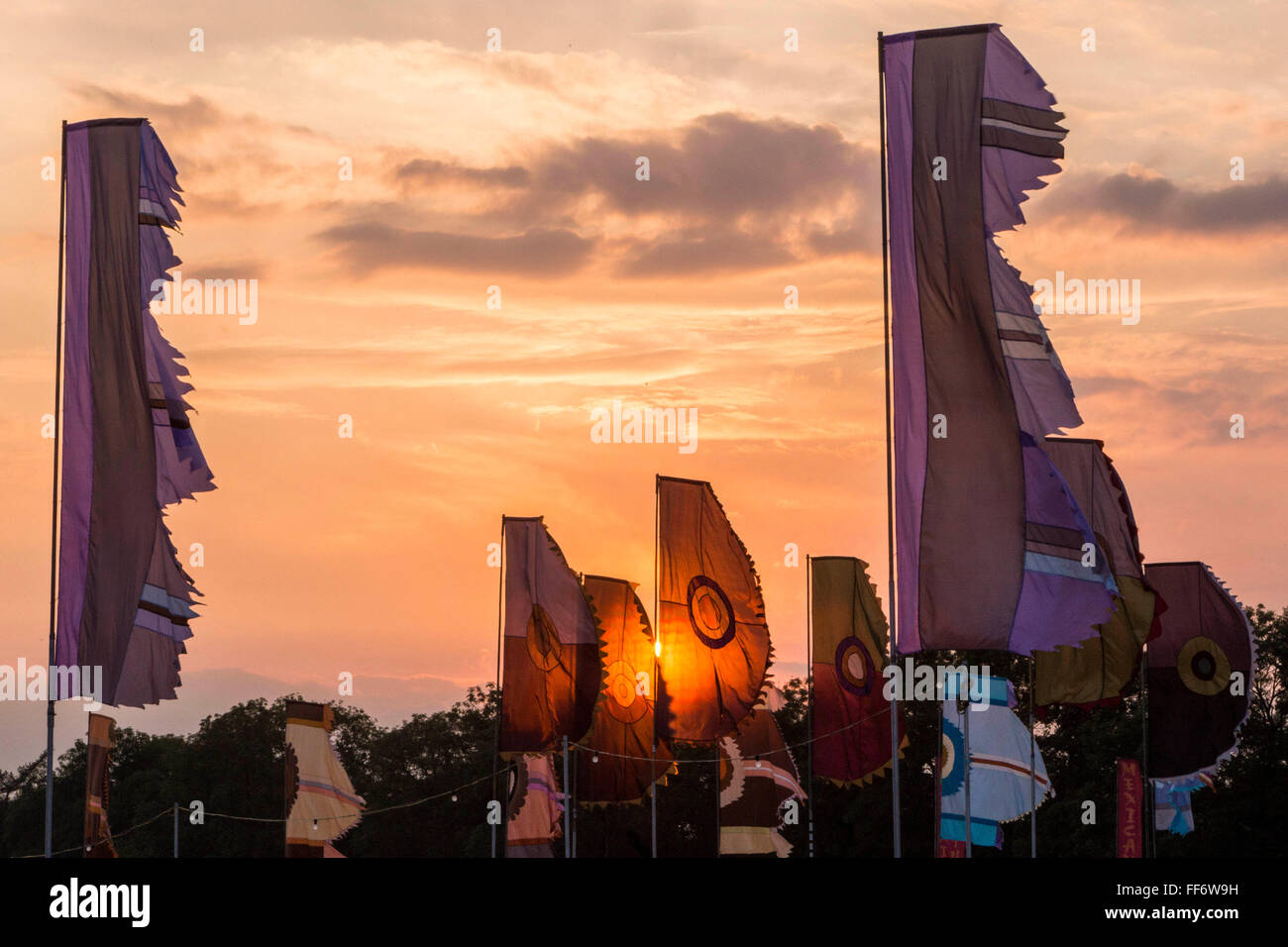 Sunset, as flags fly in the main arena.WOMAD 2014, festival of world ...