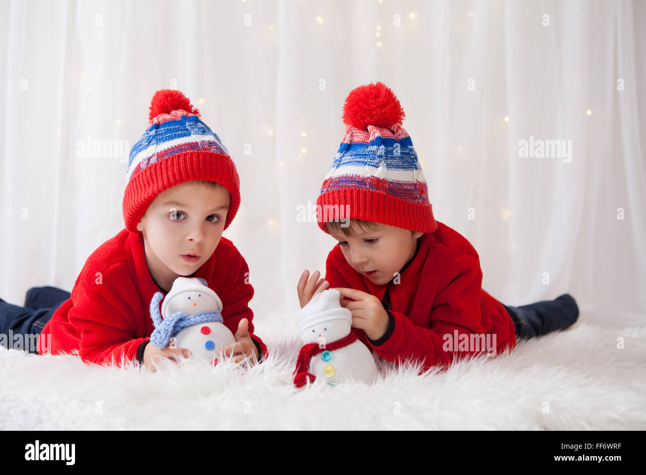 Two people with snowmen hi-res stock photography and images - Alamy