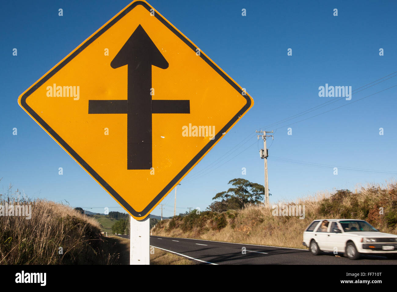 Colourful road intersection junction sign in a rural setting near Waihi ...