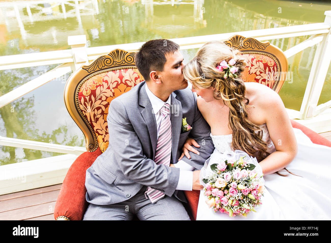 wedding pair hugging and kissing Stock Photo - Alamy
