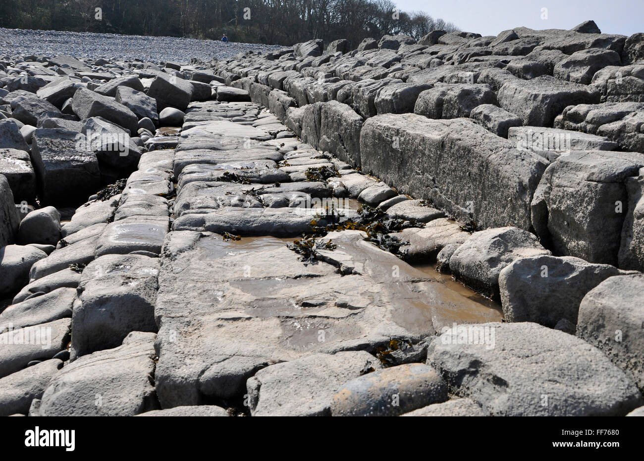 The remains the breakwater of Lilstock Harbour in Somerset, UK Stock ...