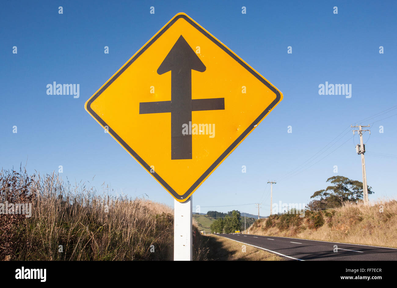 Colourful road intersection junction sign in a rural setting near Waihi ...