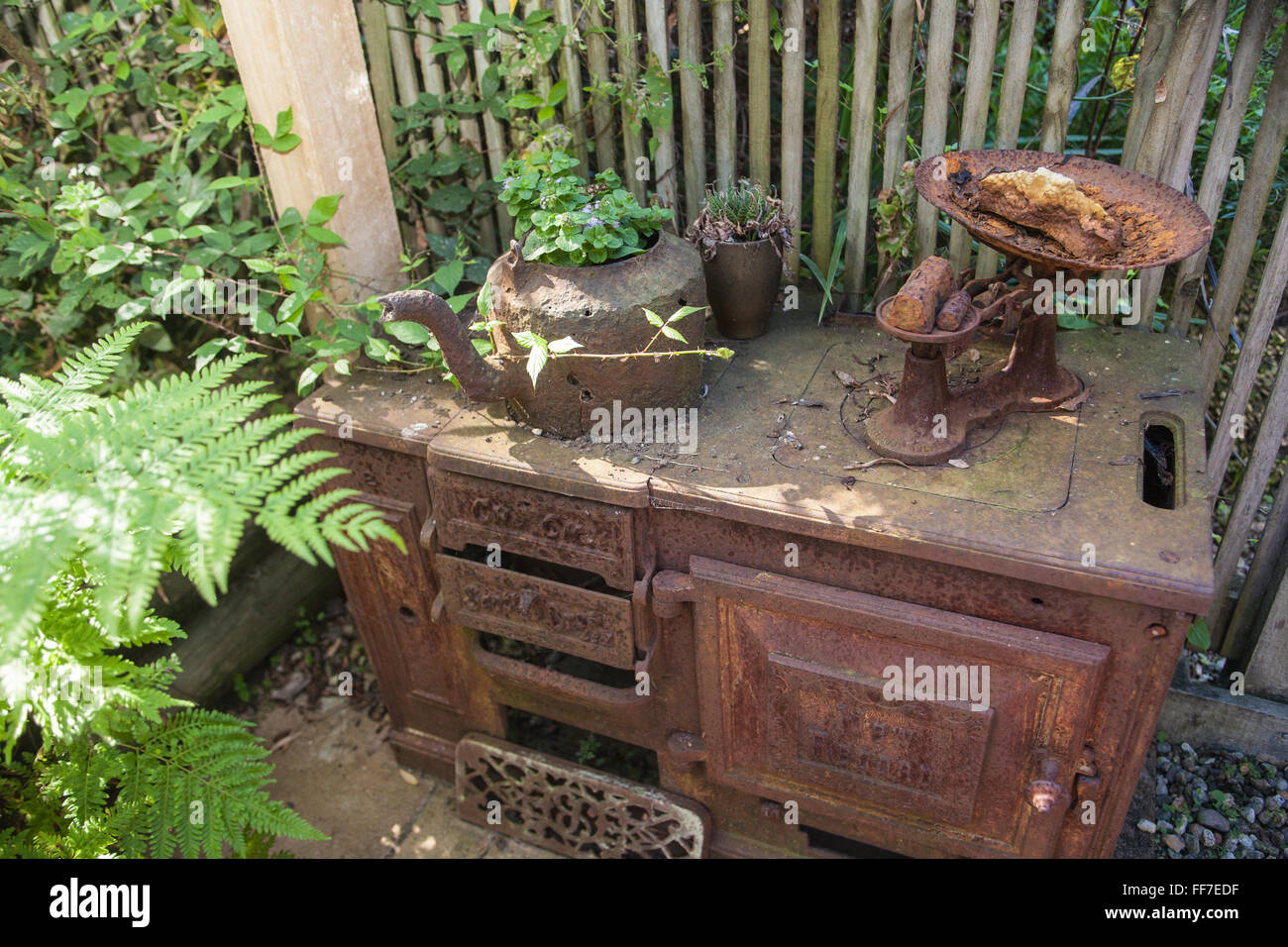 Old,rusty kettle,rusting,cooking,range in garden of residential ...