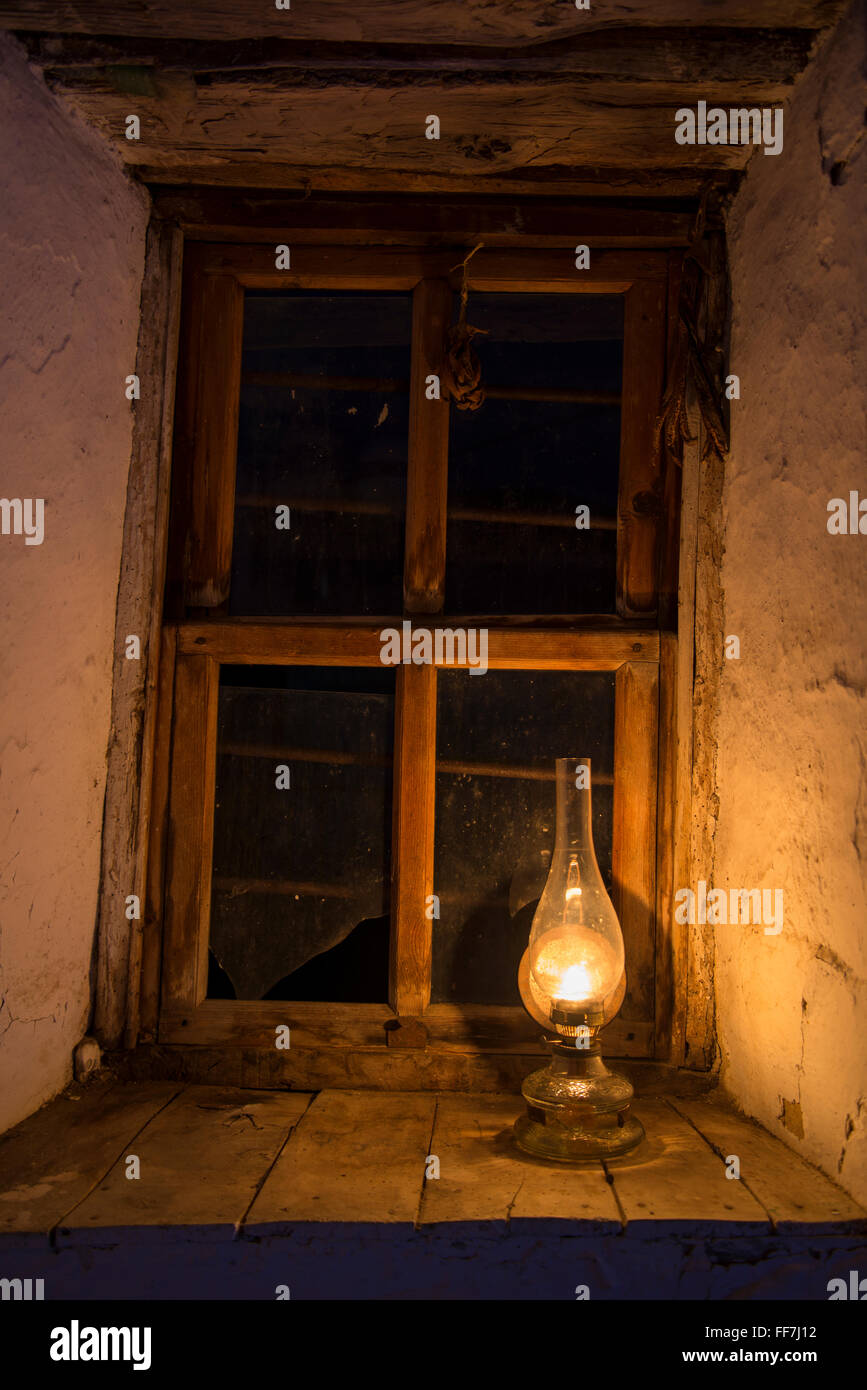 Vintage kerosene lamp at window Stock Photo - Alamy