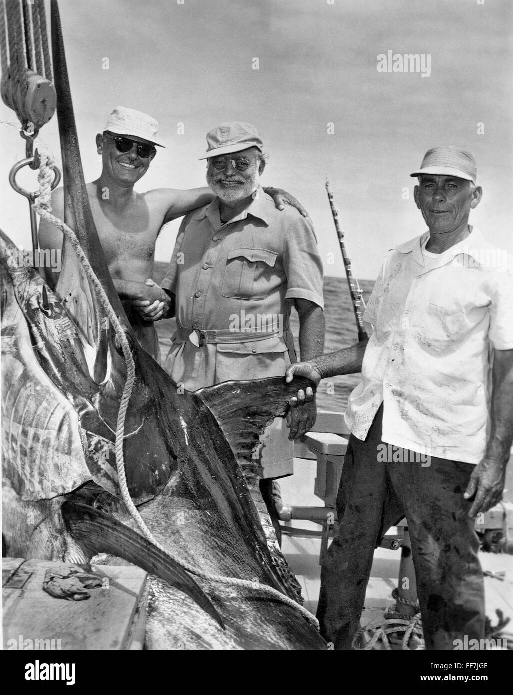 ERNEST HEMINGWAY /n(1899-1961). American writer, center, with Cuban ...