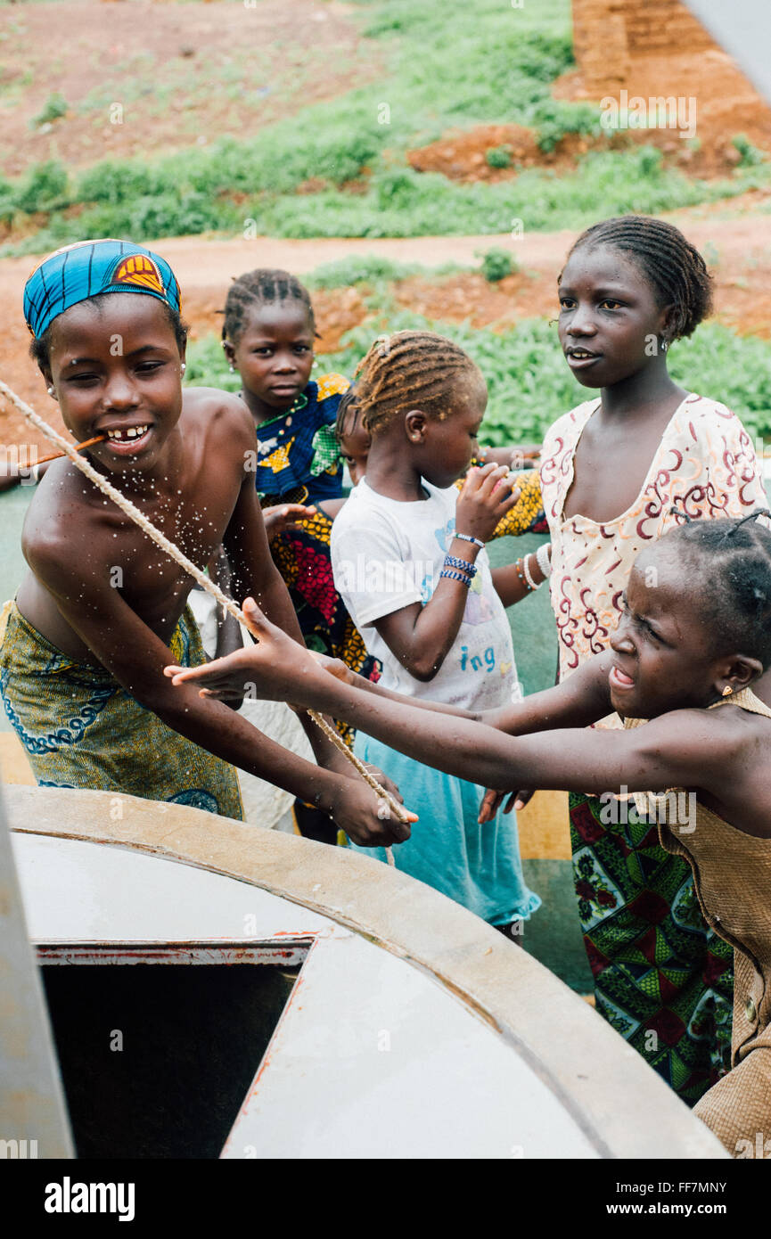 Mali, Africa - People carrying water for drinking in a village near ...
