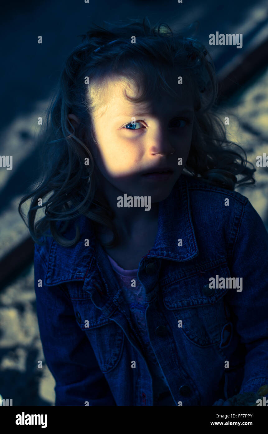 blue eye of blond girl half in shadow Stock Photo - Alamy