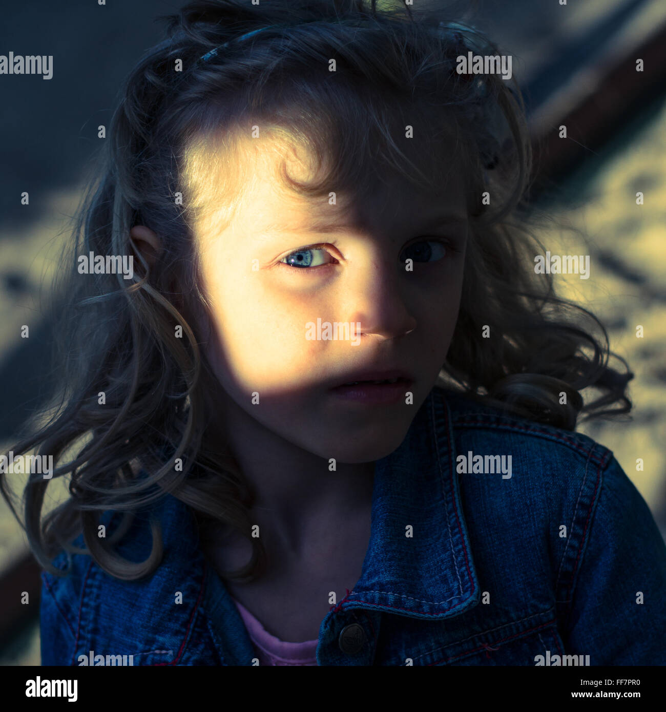 blue eye of blond girl half in shadow Stock Photo - Alamy