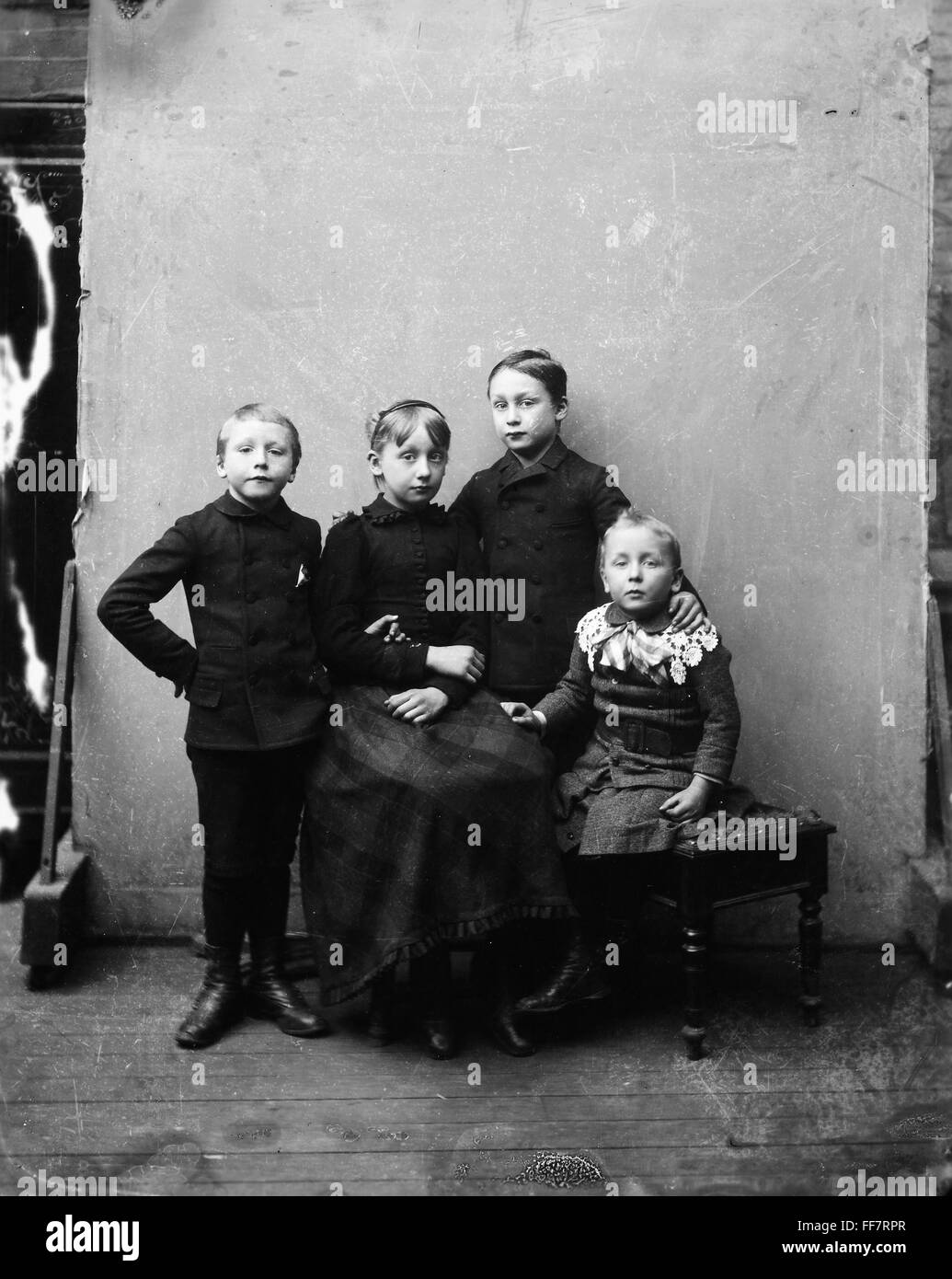 MIDDLE CLASS CHILDREN, 1900. /nFour siblings photographed in an ...