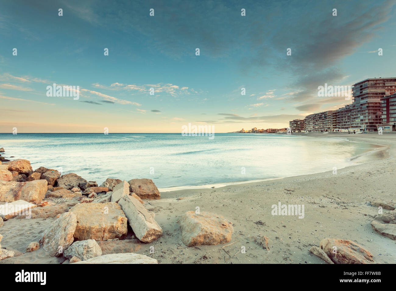 Sandy beach with waves of the see Stock Photo - Alamy