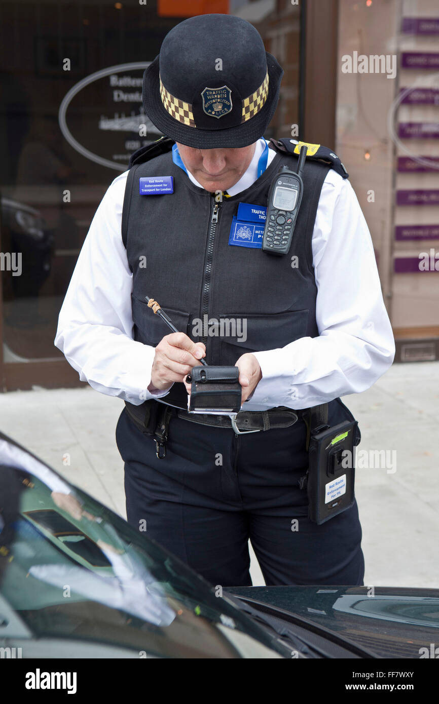 A Metropolitan Police traffic warden gives a ticket out on the Red ...