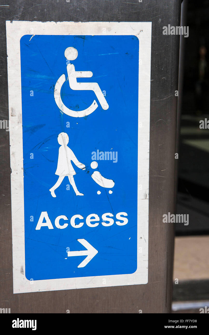 Blue sign for disabled and push-chair access to a commercial building ...