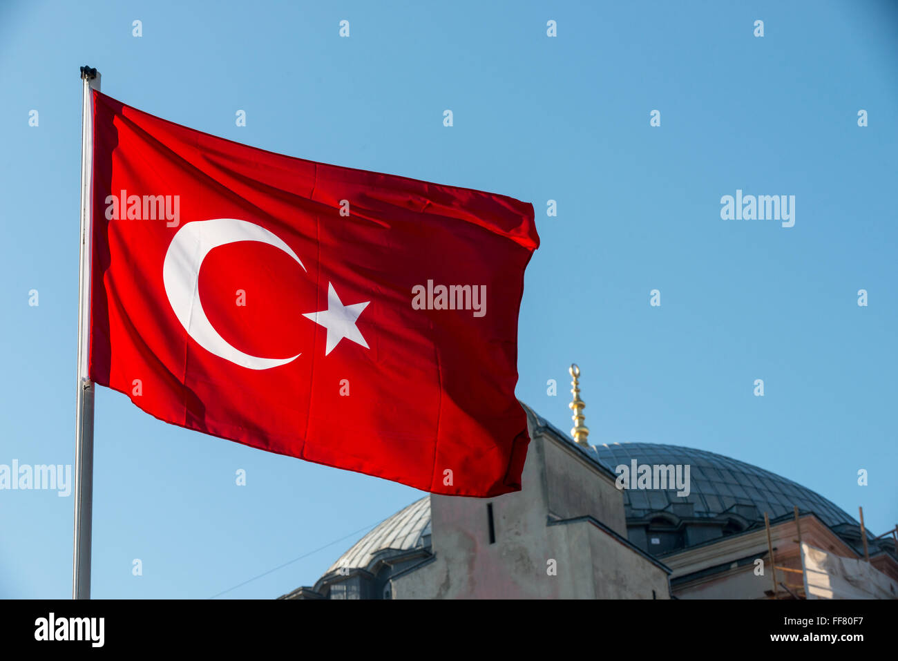 A Turkish flag flying over the city of Istanbul in Turkey Stock Photo ...