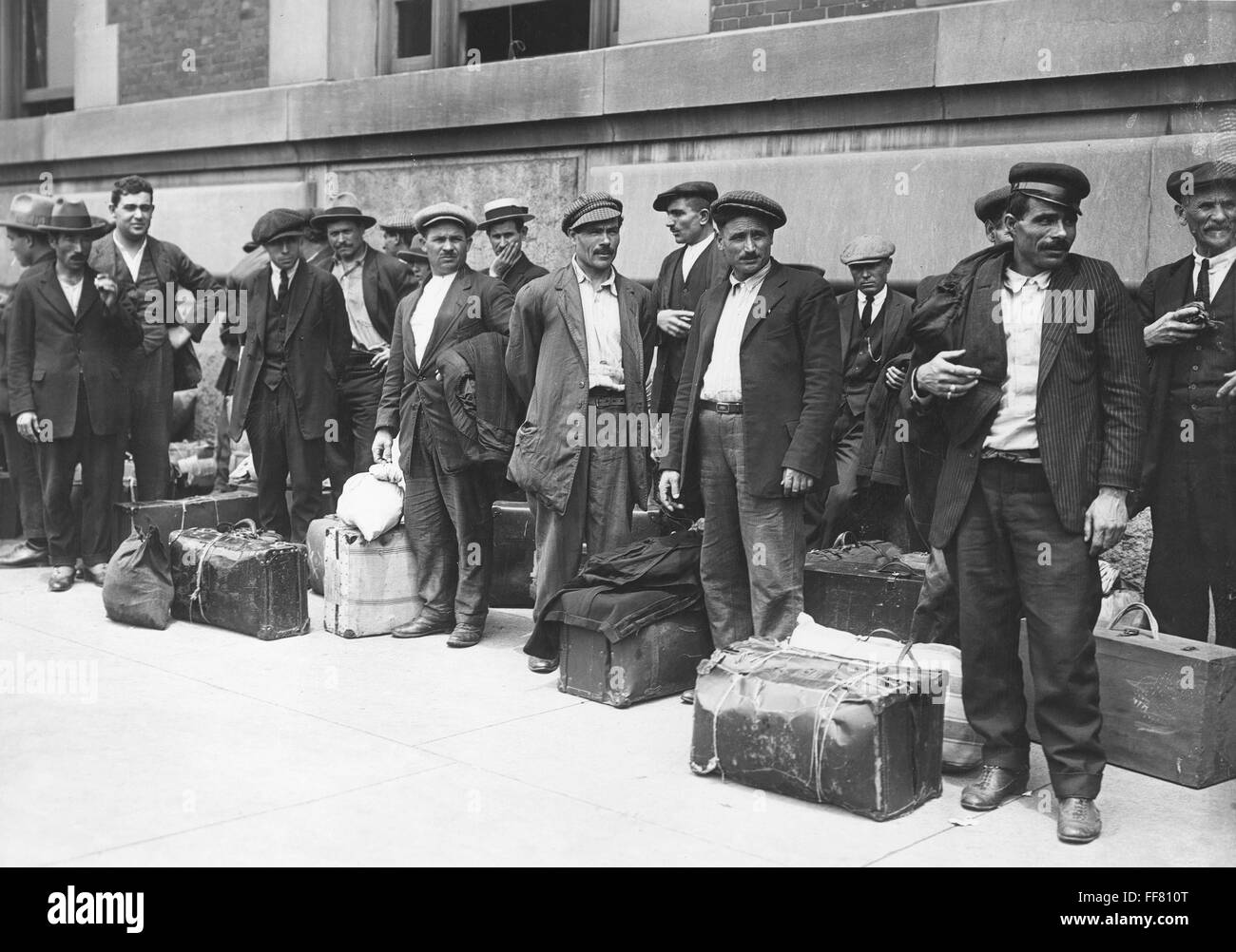 IMMIGRANTS: ELLIS ISLAND. /nA group of Italian immigrant men preparing ...