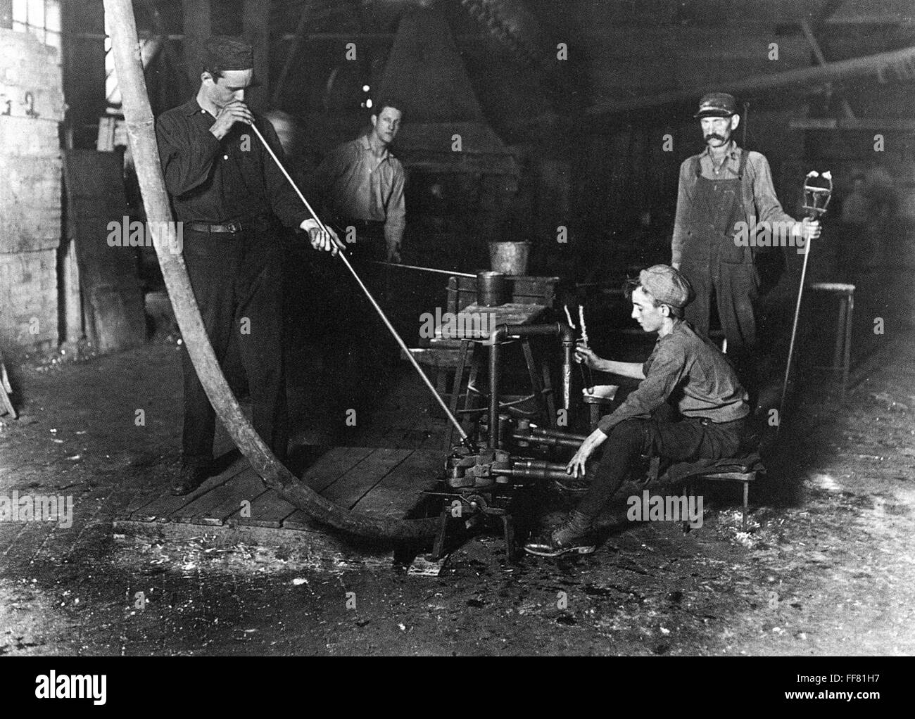CHILD LABOR, 1908. /nGlass blower and mold boy. Photographed, 1908 at ...