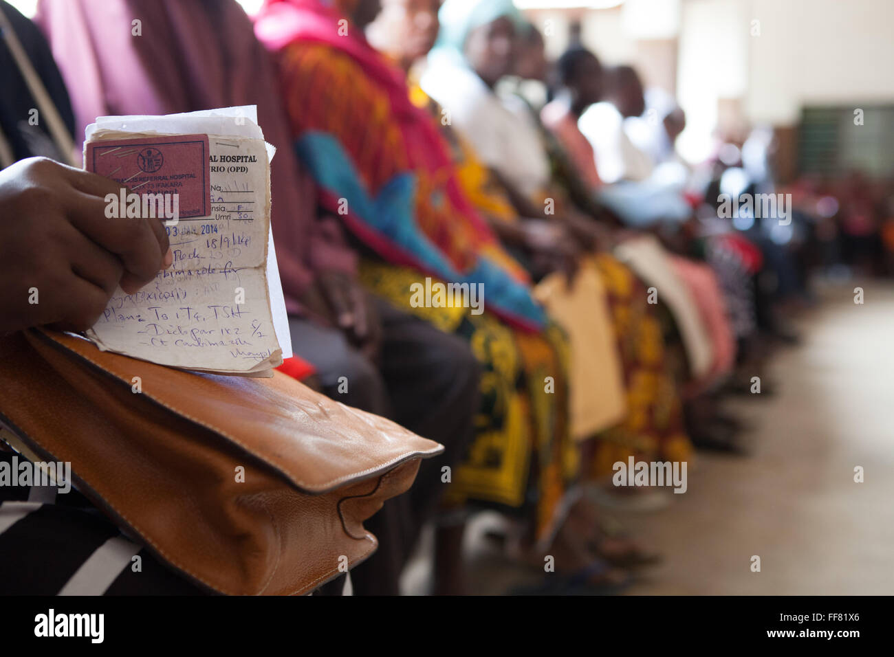 A line of waiting patients in the reception area of St. Francis ...