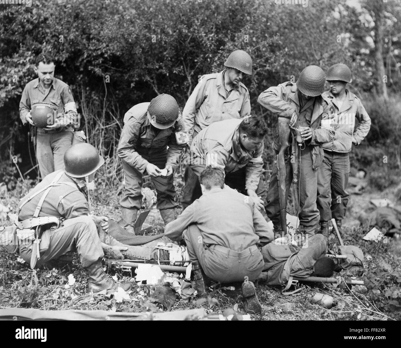 WORLD WAR II: WOUNDED GI. /nA doctor directs an operation aided by ...