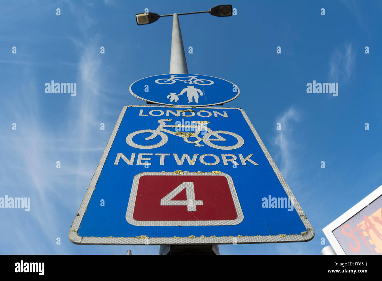 road signs indicating route 4 of the london cycle network and a non ...